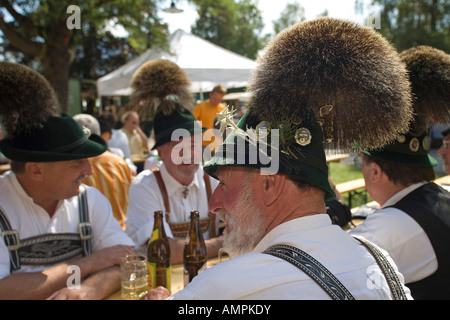 men wearing hat tuft of hair traditionally worn as a decoration Stock ...