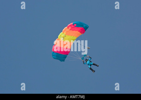 Skydiver with Rainbow colored parachute Stock Photo - Alamy