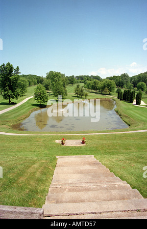 A view of a small pond showing land on all sides Stock Photo - Alamy