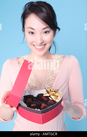 Woman having heart shaped box Stock Photo - Alamy