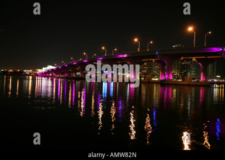Miami bridge at night with neon reflections in water Stock Photo - Alamy