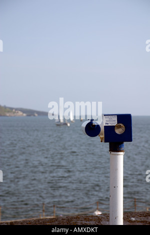Telescope and view of sailing yachts Stock Photo - Alamy