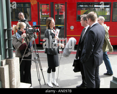tv crew conducting interview outside bbc broadcasting house London ...