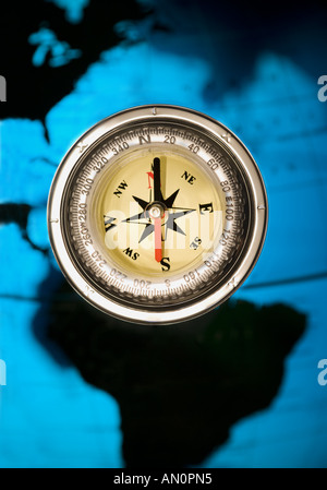 Compass and earth Stock Photo - Alamy