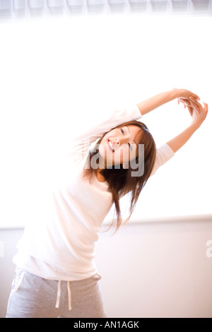 Japanese woman doing exercise Stock Photo - Alamy