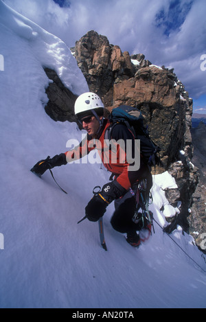 Alpine climber ascending a steep snow chute Stock Photo - Alamy