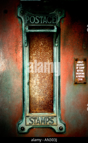 A Stamp Vending Machine (SVM) sits boarded up outside a British Post ...