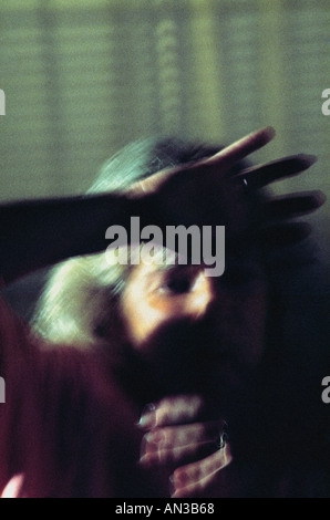 One female protecting herself with hand and help word written on. Home ...