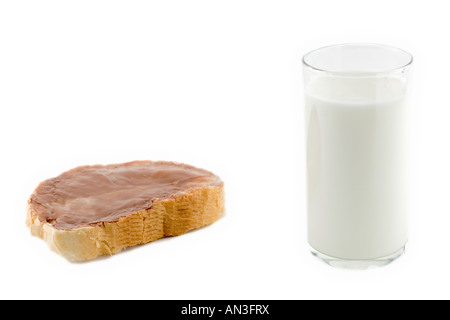 glass of whole cream milk and bread on table Stock Photo - Alamy