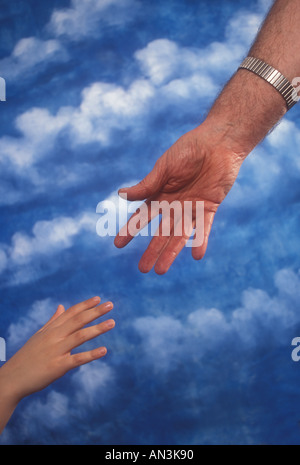 Adult and kid hands reaching to each other Stock Photo - Alamy
