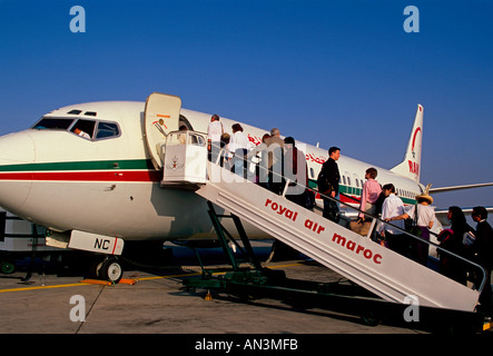 Passengers boarding a Royal Air Maroc plane at Marrakech airport ...