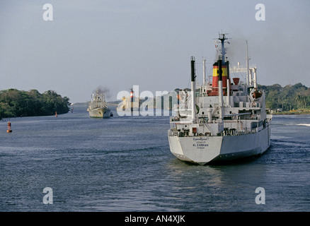 Small freighter ships make a daylight passage through the Panama Canal ...