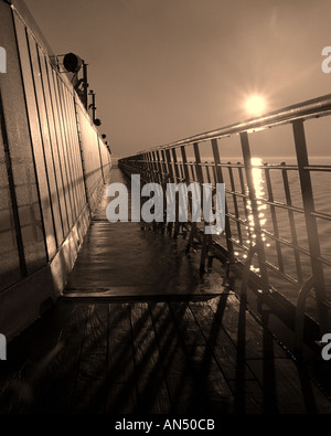 Midnight sunset from a cruise ship in the Fjords of Norway; Western ...