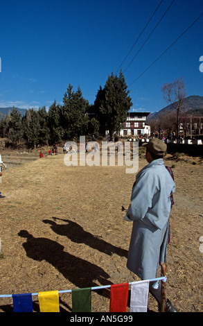 Bhutanese men in traditional costumes at at the Paro Tshechu, mask ...