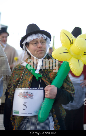 man dressed in traditional welsh folk clothing playing the violin ...