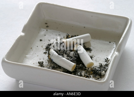 Old stale cigarette butts in a cigarette waste bin in Brighton Stock ...