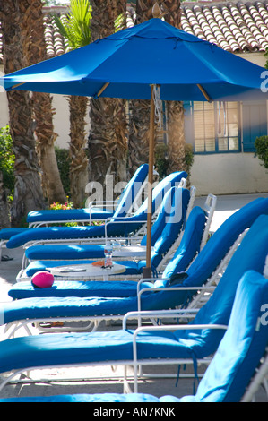 Poolside and beach side lounge chairs ad lounge beds with sun umbrellas ...