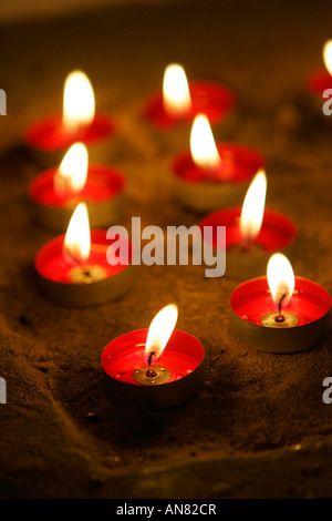 selection of candles as an offering in a church Stock Photo - Alamy