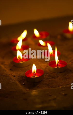 selection of candles as an offering in a church Stock Photo - Alamy