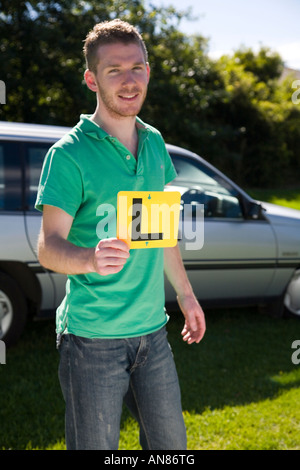 Teenager with learner driver licence plates Stock Photo - Alamy