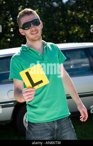 Teenager with learner driver licence plates Stock Photo - Alamy