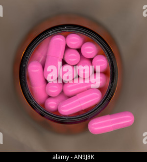 Pink Medical capsules Stock Photo - Alamy