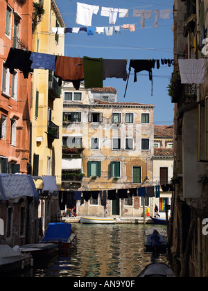 Washing lines across canal in Venice, Italy. Laundry hanging on a ...