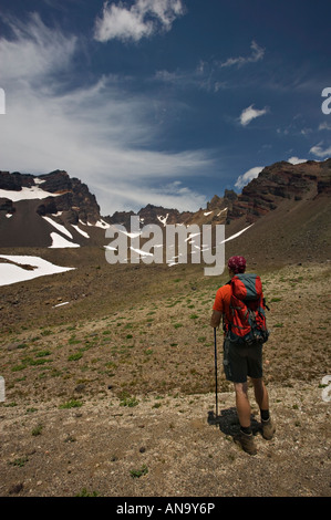 Backpacker below Broken Top Stock Photo - Alamy