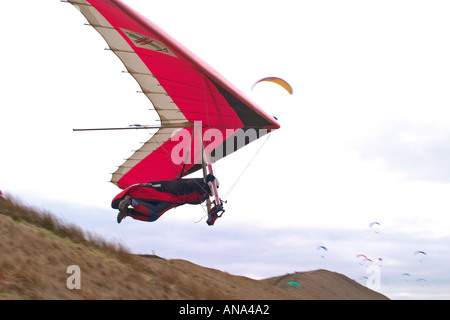 hang glider over hills in sunset Stock Photo - Alamy