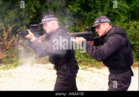 Officers from Humberside Police demonstrate the use of a baton gun to ...