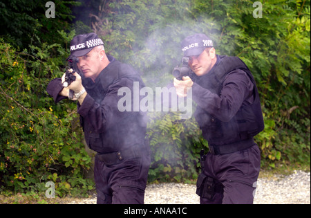 Officers from Humberside Police demonstrate the use of a baton gun to ...