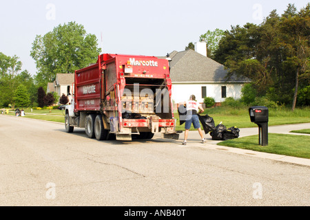 Local Neighborhood rubbish collection workers pick up household trash ...