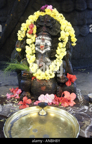 A garlanded statue of Ganesha in the Bull Temple in the Basavanagudi ...
