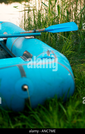 Rubber boat on a lake shore Stock Photo - Alamy
