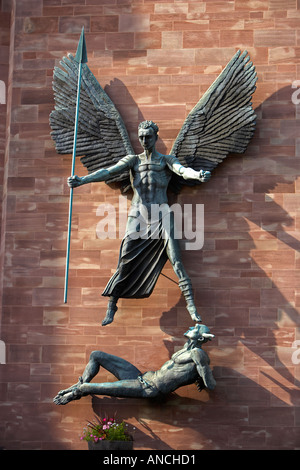 The statue of Saint Michael defeating Satan on the side of the new ...