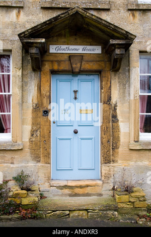 Front door and porch of typical Cotswolds cottage in village in ...