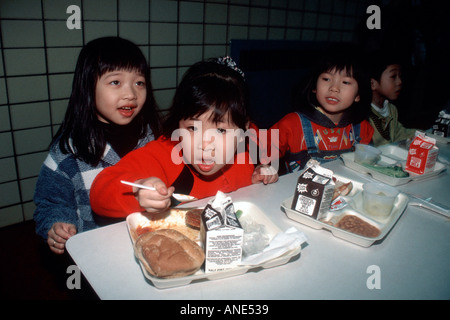 Chinese students eat lunch in the canteen at a senior high school in ...