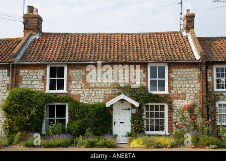 A Traditional English Village Brick and Flint Cottage Stock Photo - Alamy