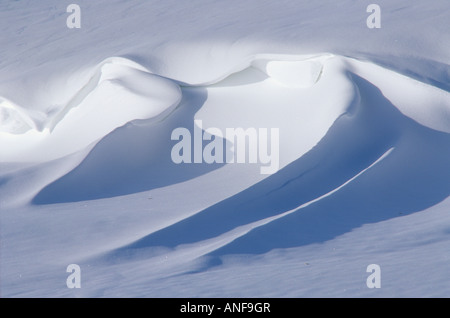 Canada, Manitoba, Dugald. Wind blowing snow on prairie at sunset Stock ...