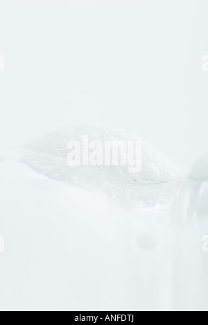 White bubbles foam from soap, shampoo, cleanser or detergent background ...