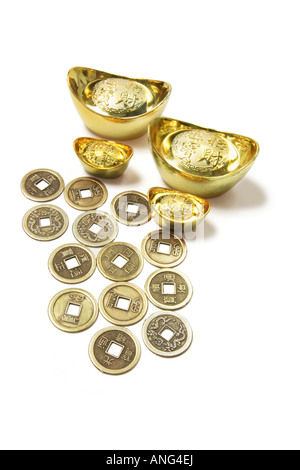 Chinese Gold Ingots and coins in treasure chest on yellow background ...