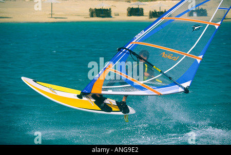 windsurfer jumping off light blue chop wave Red Sea Sinai Egypt Stock ...