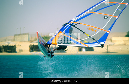 single male windsurfer jumping on chop waves Red Sea Sinai Egypt Stock ...