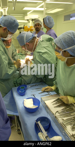 Medical team performs a surgical operation in a modern operating room ...