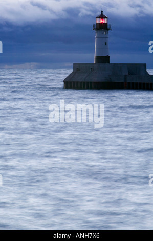 Duluth Harbor. Shipping Channel Lighthouse at Dawn with Freighter ...