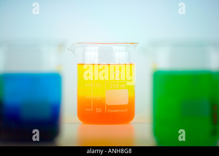 3 three beaker chemical beakers with coloured liquids Stock Photo - Alamy