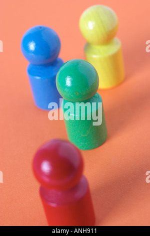 Coloured pawns in a game Stock Photo - Alamy