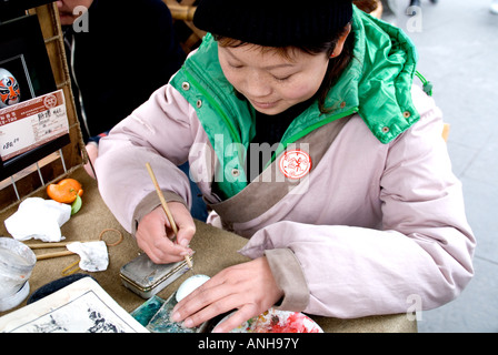 A chinese woman doing handwork Stock Photo - Alamy
