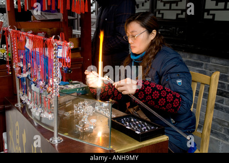 A chinese woman doing handwork Stock Photo - Alamy