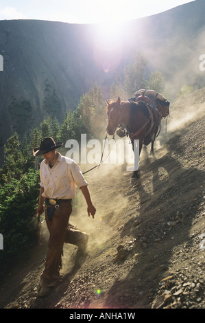 leading a horse in the South Chilcotin Mountains, near Gold Bridge ...